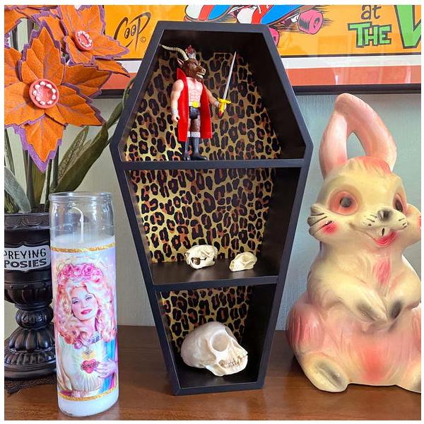 SOURPUSS LEOPARD COFFIN SHELF<br><br>SOURPUSS coffin shelf has had a makeover. The leopard printed backdrop ...