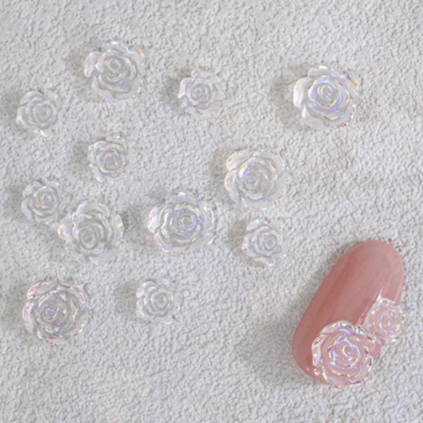 繊細なバラの形のパーツです。置くだけでアートが仕上がります。寸法：大 8ｍｍ×8ｍｍ×4ｍｍ　　　　小 6ｍｍ×6ｍｍ×3ｍｍ※ひとつひとつ手作業の為、大きさや形、色味に個体差があります。あらかじめご了承ください。８ｍｍ×６個、６ｍｍ×６個