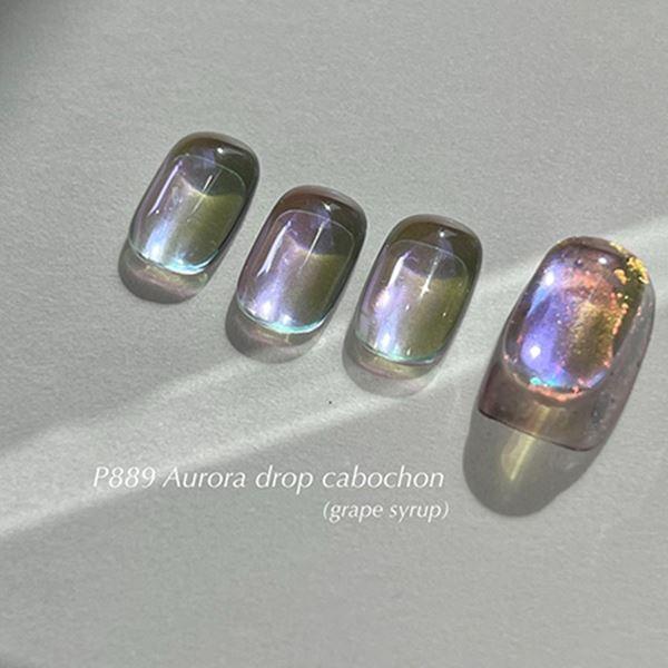 (grape syrup)縦長の13mm×7mmのオーロラカボションパーツです。飴のような美味しそうなカラーとツヤが美しいインパクトパーツです。裏面は平面のため、比較的安定感を出すことが出来ます。内容量:6個