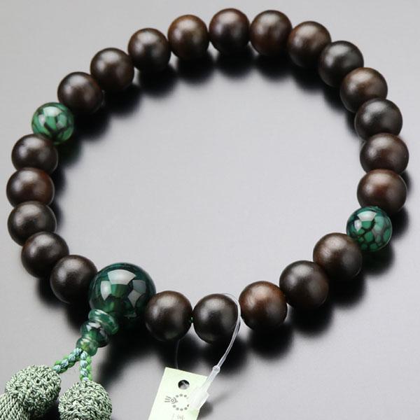 すべての宗派のお客様にお使い頂ける男性用のお数珠でございます。素材は、艶消し加工が施された縞黒檀でございます。アクセントには、緑龍紋瑪瑙を使用させて頂きました。石の特性上、模様部分に細かなヒビが入っております。黒色と緑色のコントラストが男ら...