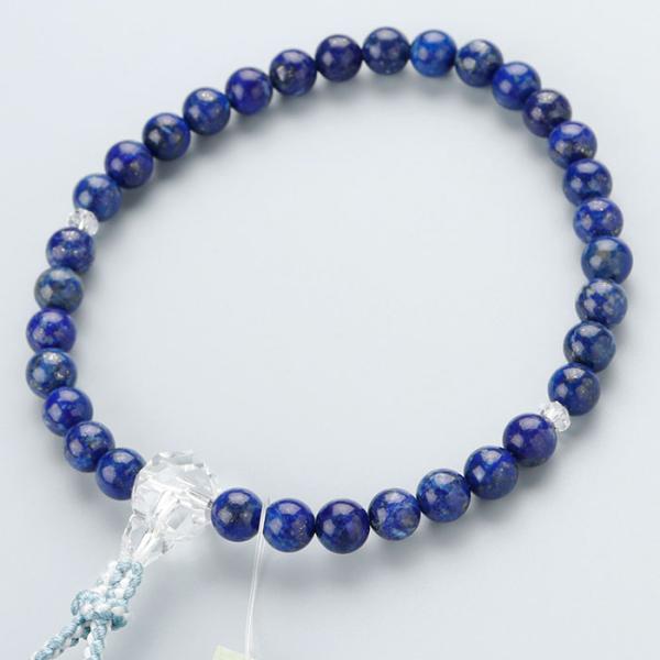 すべての宗派のお客様にお使い頂ける女性用のお数珠でございます。素材は、素材は、9月と12月の誕生石、2A´ラピスラズリでございます。アクセントに、カット水晶を入れ上品に仕上げております。約8ミリサイズでございますので高級感を感じていただけま...