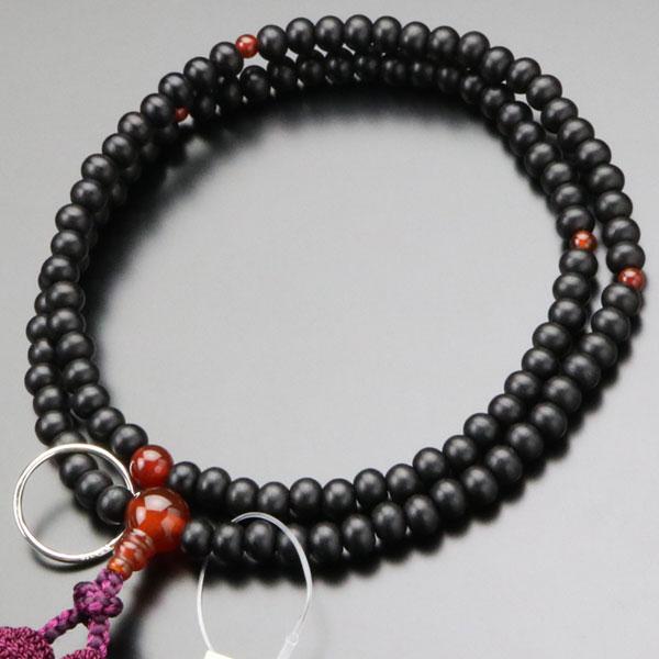 曹洞宗、女性用の正式なお数珠でございます。素材は、高級感のある艶消し加工が施された黒檀でございます。非常に硬く、耐久性にも優れた素材で、使い込むほどに味わい深い質感のある色合いに変化してまいります。アクセントには、深い赤色の瑪瑙を合わせ、上...