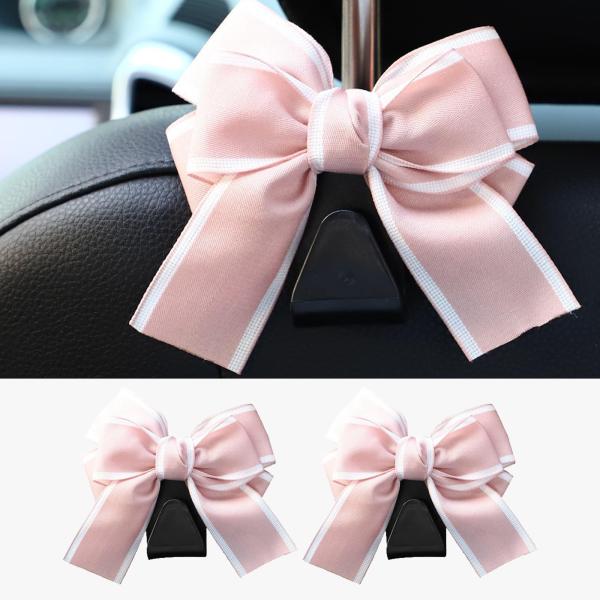 商品名: Couslcd カーシートフック 2個 かわいいリボン カーシートヘッドレストフック 財布 バッグ 傘用 ユニバーサル自動車インテリア装飾アクセサリー 車 SUV セダン トラック用 (ピンク) Couslcd 2PCS Car ...