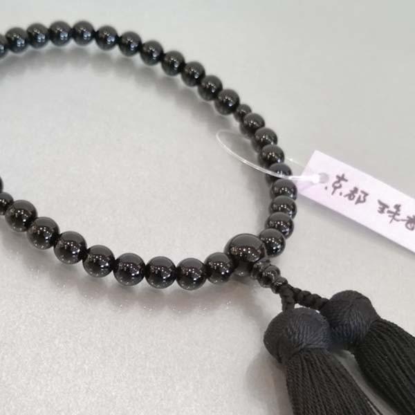 商品分類:数珠商品説明:【商品コード：2254】■珠の素材●主珠：黒オニキス（約7mm）●親珠：黒オニキス（約10mm）●天珠：黒オニキス（約5mm）■房の素材●正絹古都房（房、通し糸共正絹）■特徴主珠、親珠、天珠に黒オニキスを使った女性用...