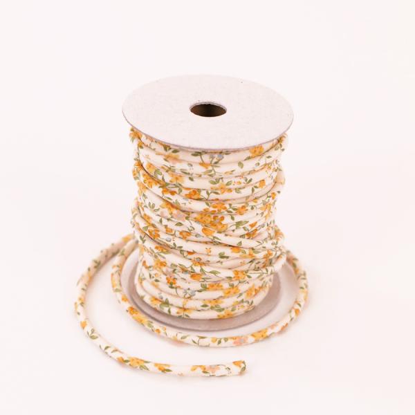 ■表地：綿100%　中芯：アクリル100%※10cm単位で販売、価格は10cm分。数量は10cm単位で入力して下さい(例:1m購入なら数量10)。お庭に咲いているようなお花たちが木綿の丸ひもになりました。小さな柄でとにかくカワイイ！洋風なデ...