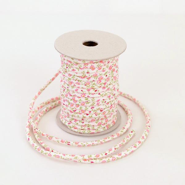 ■表地：綿100%　中芯：アクリル100%※10cm単位で販売、価格は10cm分。数量は10cm単位で入力して下さい(例:1m購入なら数量10)。お庭に咲いているようなお花たちが木綿の丸ひもになりました。小さな柄でとにかくカワイイ！洋風なデ...
