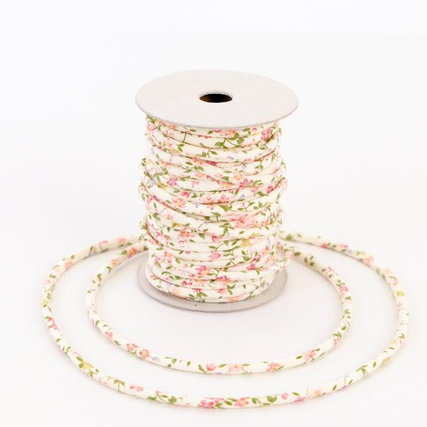 ■表地：綿100%　中芯：アクリル100%※10cm単位で販売、価格は10cm分。数量は10cm単位で入力して下さい(例:1m購入なら数量10)。お庭に咲いているようなお花たちが木綿の丸ひもになりました。小さな柄でとにかくカワイイ！洋風なデ...