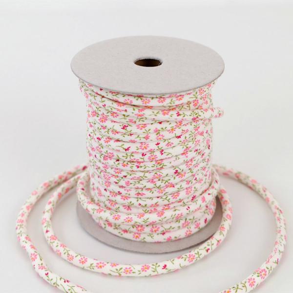 ■表地：綿100%　中芯：アクリル100%※10cm単位で販売、価格は10cm分。数量は10cm単位で入力して下さい(例:1m購入なら数量10)。お庭に咲いているようなお花たちが木綿の丸ひもになりました。小さな柄でとにかくカワイイ！洋風なデ...