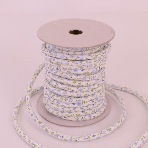 ■表地：綿100%　中芯：アクリル100%※10cm単位で販売、価格は10cm分。数量は10cm単位で入力して下さい(例:1m購入なら数量10)。お庭に咲いているようなお花たちが木綿の丸ひもになりました。小さな柄でとにかくカワイイ！洋風なデ...