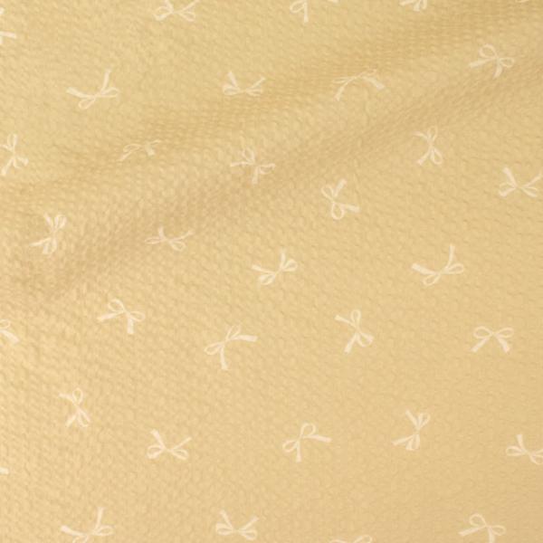 ●素材：綿100％●生地幅：約108cm【生地の特徴】韓国トレンドのくすみカラーにリボンがプリントされたリップル生地です。ぽこぽこと凹凸のあるリップル生地は通気性がよくべたつかないので、夏の暑い時期にぴったりです。甚平や浴衣はもちろんですが...