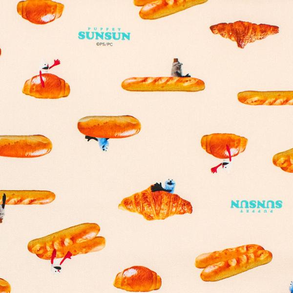 ●素材：綿100％●生地幅：約108cm【商品の説明】人気のパペットスンスンの生地です。おいしそうなパンからひょっこり顔を出しているスンスン・ノンノン・ゾンゾンがかわいらしいデザインです。柄の上下がないので、裁断も簡単です。中肉程度の厚みの...