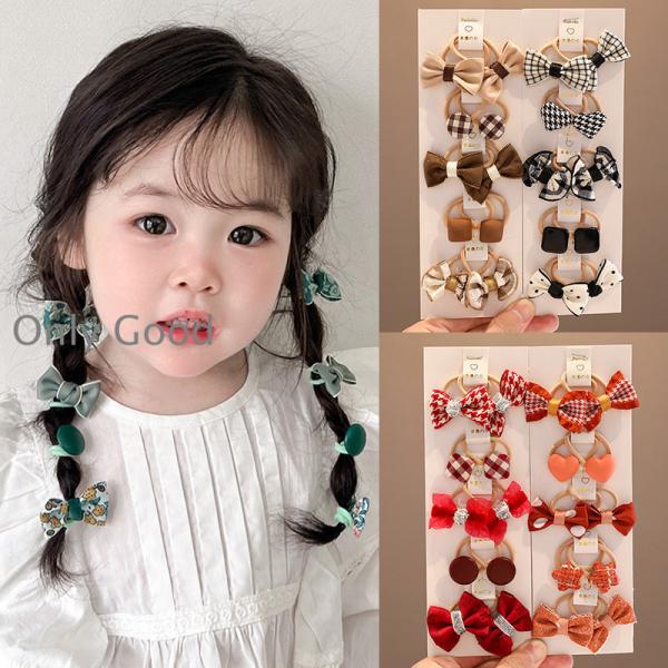 リボンやフラワーモチーフの可愛いデザイン?10本の子供用ヘアゴムセットです。【カラーについて】生産ロットにより柄の出方や色の濃淡が異なる場合がございます。お使いのモニターや撮影時の光の加減などにより画像と実際の商品のカラーが異なる場合もござ...