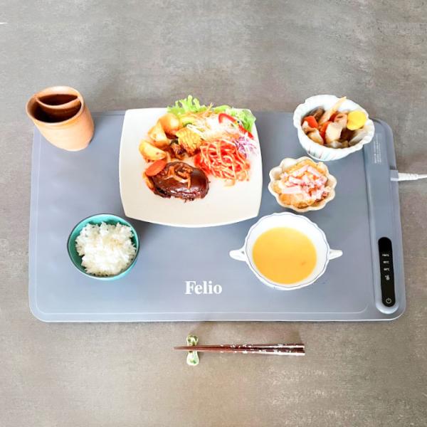 従来市場にあるガラス天板の保温機と違い、シリコーン素材で割れる心配もなく、接地面が稼げるため食器を選びません。三段階の温度調整機能で、食事に合わせて保温能力を調整できます。ランチョンマット感覚で気軽にお使いいただける商品です。