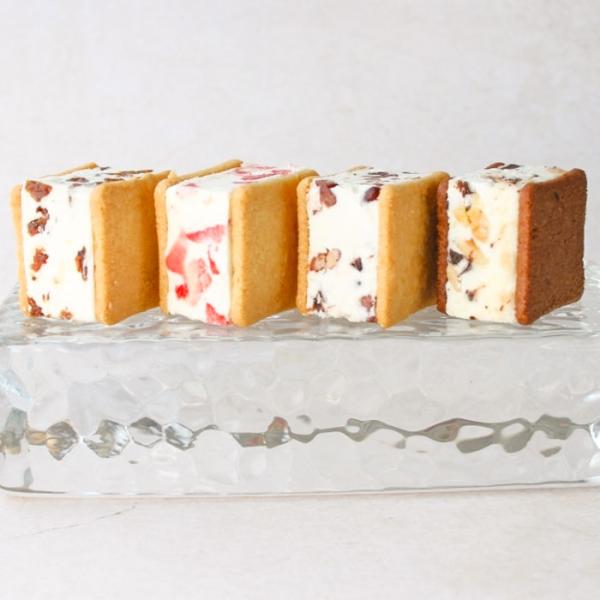 堀江バターサンドは、極厚バターサンドの火付け役としても知られ、自然な甘さと深いコクを持つ、大人にこそ贈りたい洗練された4つの味わいのレギュラーフレーバーアソートセットです。レーズンバターは、ホワイトチョコを混ぜ込んだバタークリームを洋酒で香...