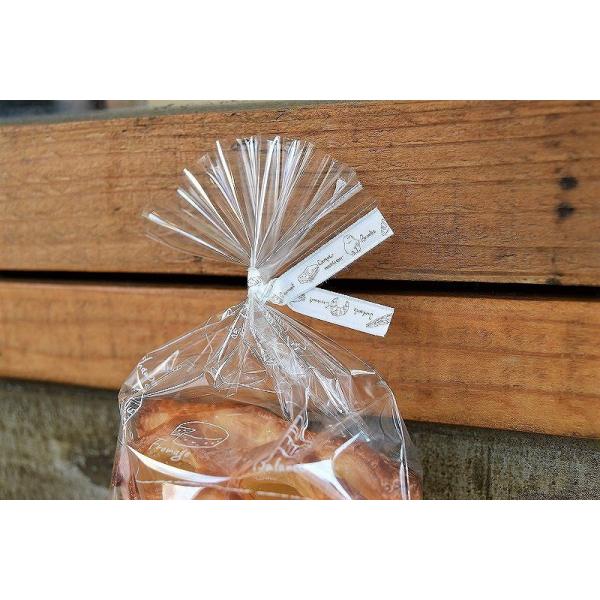 1セット入り数：100本　 　サイズ　  ：8×120mm　　 材質　　 ：紙/鉄芯　　 特長　　 ：当店オリジナルの袋の留め具としてお使い頂ける和紙タイです。　　　　 　　　  様々なパンの絵が描かれています。　　　　　　　 印刷は片面の...