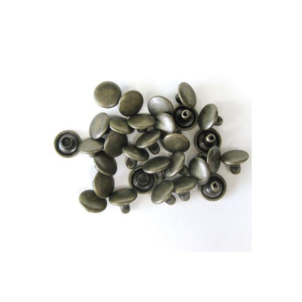 頭(メス)の直径9mm、足(オス)9mmの真鍮製の大カシメの足並です。真鍮製。両面タイプ。足軸径3mm。革や布の厚みが厚み4mm程度のものにお使いください。6mm以上の場合は足並タイプをご検討ください。