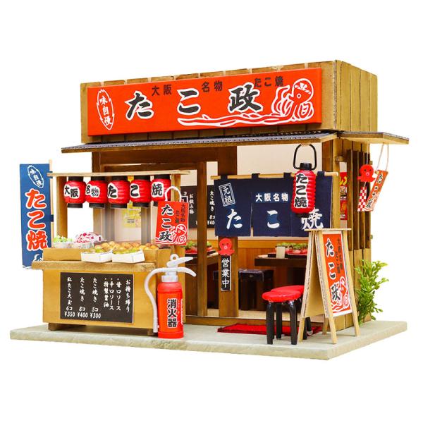 西のご当地、ナニワのたこ焼き屋さんを再現したミニチュアキット。パッと目を引くカラフルな提灯・ソースの香り漂う店頭屋台・レトロな格子窓など、誰もが一度は見たことがあるナニワおなじみの粉もん屋さんに仕上がりました【キーワード】おもちゃ,玩具,オ...