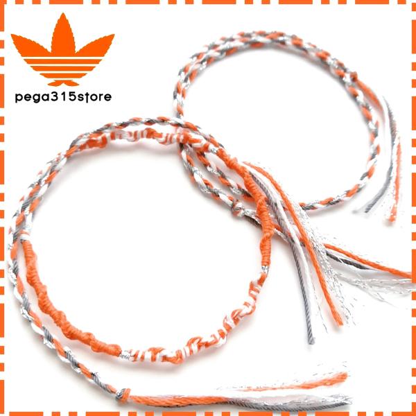 足用ミサンガです。ツイードのスポーティーなデザインです♪バイカラー配色でワンポイントラメが入っています　スポーツMIXやクラッシックHIPHOPスタイルに是非♪長さ：約３５ｃｍ素材：刺繍糸色：オレンジ　橙・白　ホワイト・灰色　グレー・シルバ...