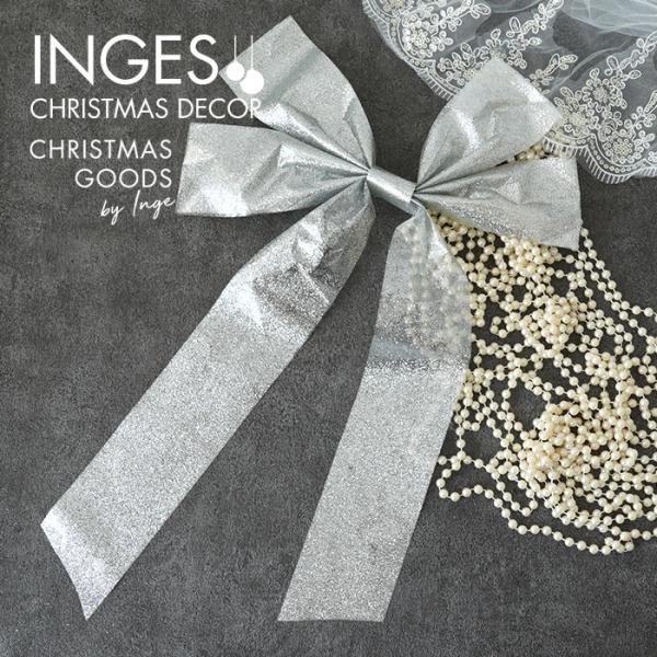 ツリーの緑によく映える上品なシルバーのトップリボンです。大ぶりの輪と長めに落とされた裾のシルエットによってエレガントな雰囲気を醸し出します。ラメ付きなので自然光やイルミネーションに照らされてキラキラとした上品な輝きを放ちます。シンプルなデザ...