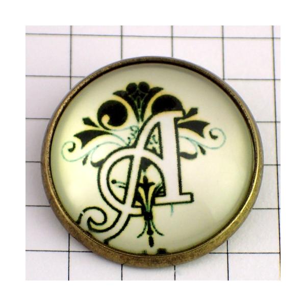 直径約２２ミリ、厚みは約６ミリです。表面のコーティングはガラスで、ドーム状になっています。他のアルファベットや数字もございます。ぜひご覧ください。背景の１マスは５mmです。