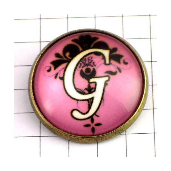 直径約２２ミリ、厚みは約６ミリです。表面のコーティングはガラスで、ドーム状になっています。他のアルファベットや数字もございます。ぜひご覧ください。背景の１マスは５mmです。