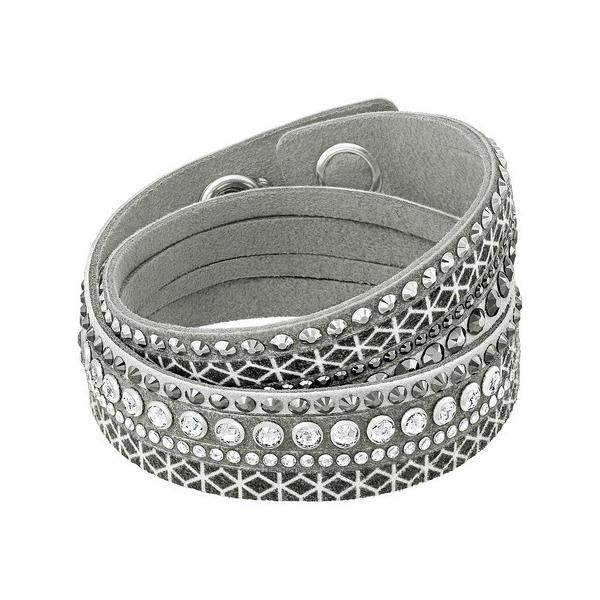 スワロフスキー『Slake Print ブレスレット』です。Slake シリーズから新登場した、心躍る幾何学プリント柄のブレスレット。グレーのアルカンターラ〓（人工皮革）にダークトーンをミックスしたラウンドカットのクリスタルを散りばめていま...