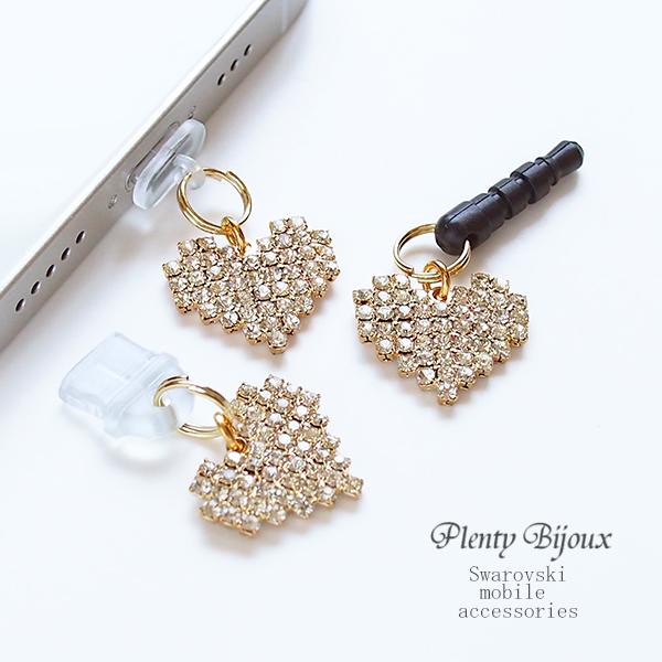 キラキラのラインストーンがデコレーションされたピクセルハートデザインのモバイルアクセサリー。スマートフォンコネクター ３タイプに対応。コネクタの防塵カバーとしても役立ちます。細かな細工はジュエリー級！スマホが揺れるたびにキラっとして人目を引...