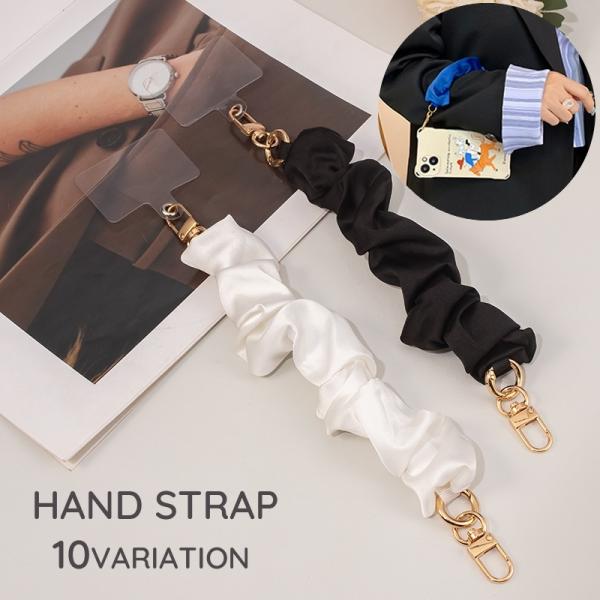 かわいいシュシュ風デザインのスマホ用ハンドストラップ。プレートをスマホとスマホカバーの間に挟むだけ♪スマホの落下防止＆紛失防止に◎【サイズについて】画像をご参照ください。【素材について】ポリエステル【カラーについて】生産ロットにより柄の出方...
