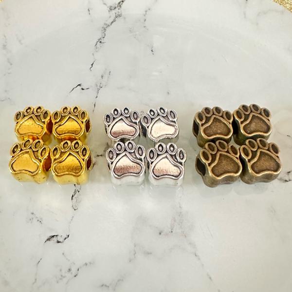 革紐などでアクセサリー作りに使用するアクセント スライダーチャームカラー アンティークシルバーアンティークゴールドブロンズゴールド(金古美)Size: 約 11mm×10.6mm×7.5mm ホール4.8mm              素材...