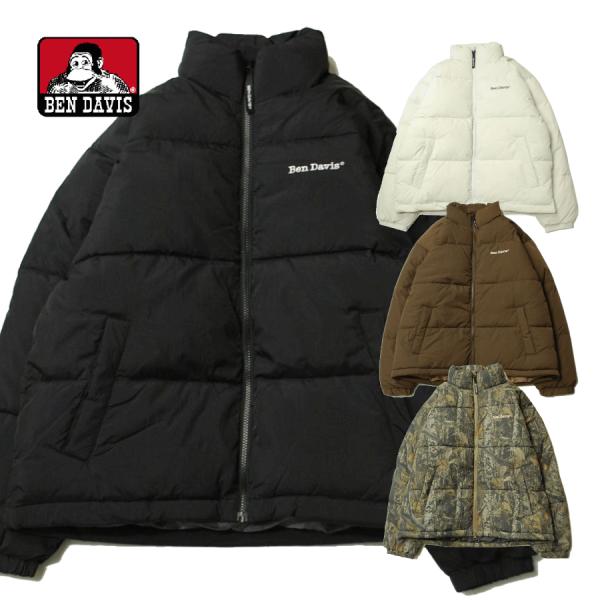 表地にタスランナイロンを使用したフェイクダウンジャケット。オーセンティックな平行ステッチにスタンドカラー、ショート丈、ボリューム感があり、男女ともに着やすいデザインです。左胸にロゴ刺繍、ロゴ入りファスナープルタブ、裾内側に調整可能なゴムスピ...