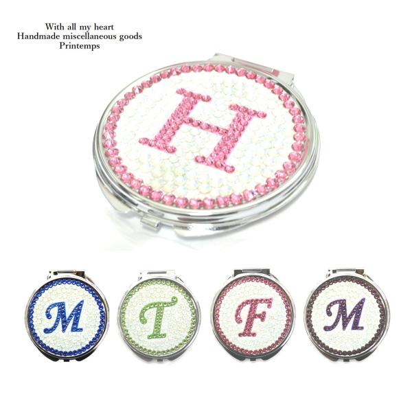 ラウンド型両面コンパクトミラー使用パーツ：SWAROVSKI ELEMENTS資材カラー：シルバーサイズ：70mm×70mm×18mm重さ：50g大きめのラウンド型ミラー。薄型で拡大鏡も付いてとても見やすいミラーですふんわりと優しい色のホワ...