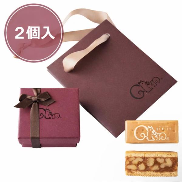 【商品概要】鎌倉紅谷クルミッ子プチギフトBOX（2個入）ぎっしりと詰まった歯ごたえのよいクルミと、甘さとほろ苦さの絡み合った自家製キャラメルをバター生地ではさんだ贅沢な焼き菓子です。クルミとキャラメルの絶妙な配合に加え、しっかりとした生地が...