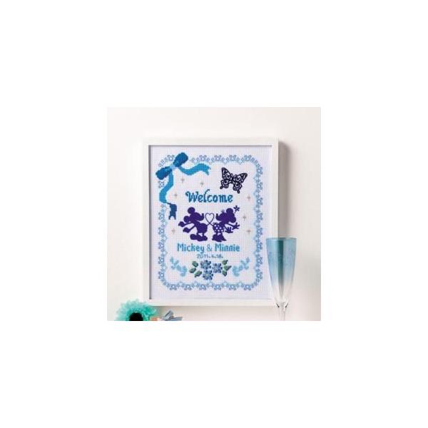 お花やリボンなどかわいいモチーフが魅力のウェルカムボード。中心のミッキー＆ミニーと蝶々はフロッキーワッペンです。技法はクロス・ステッチ。額(W-35)は別売。技術レベルは初級~中級者向。 製造国:日本 素材・材質:布、ししゅう糸:綿100%...