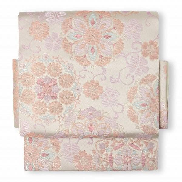 光沢のあるサクラ色地に華文や唐花文様を織り出しました。フォーマルにご利用頂ける格調ある袋帯です。お太鼓と胴回り部分が分かれた二部式仕立てで、簡単に結んで頂けるようになっています。お太鼓部分は二重太鼓。フォーマルなご用途にご利用頂けます。