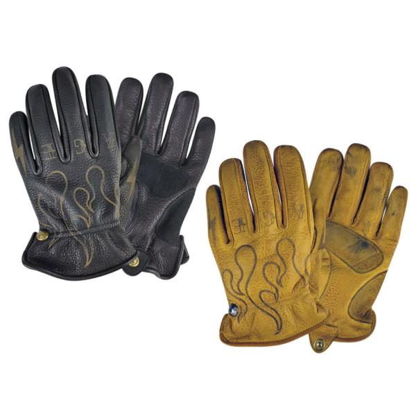 甲部にフレアー＆タトゥー柄のレーザープリントを施したNAKEDグローブ。鹿革のようなしなやかさのある山羊革を使用し、全体的にエイジングを施し（汚し加工）、やれた雰囲気を演出。手首以降を短めに設定し、すっきりとしたシルエットに仕上げました。