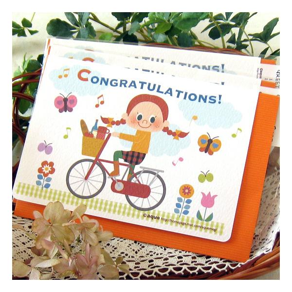 どんぶらコッコ☆さんオリジナルイラストのグリーティングカード。自転車にのった可愛い女の子と「CONGRATULATIONS」の文字が描かれています。お誕生日、結婚、進学、就職などなど、、お祝いの場面に使えます。カラフルでキュート★ざらりとし...