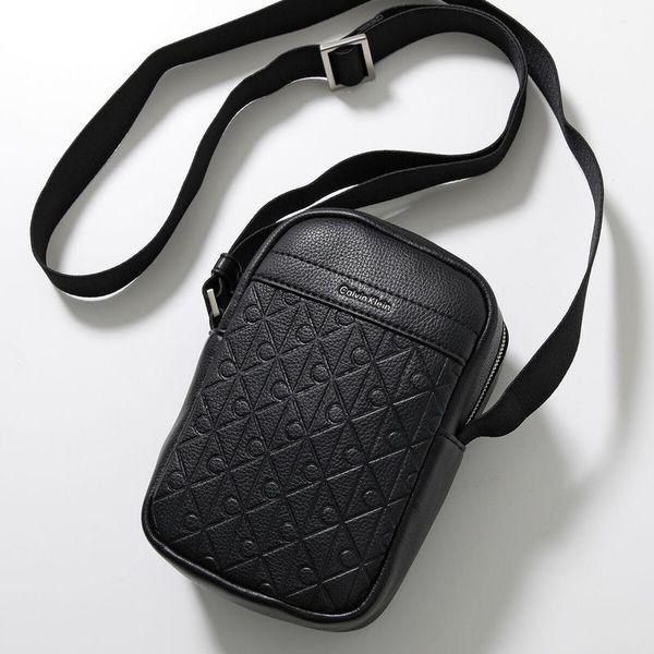 Calvin Klein カルバンクライン ショルダーバッグ EMBLEM AOP EMBOSS SLIM REPORTER LV04D3228G メンズ フェイクレザー ロゴ 鞄 UB1/Black クロスボディ エコレザー/【2026年...