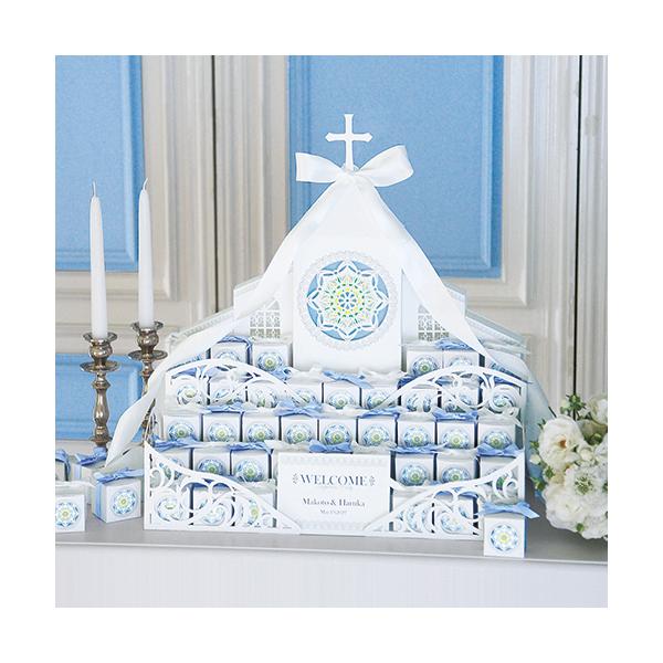 幸せの演出＆ウエルカムギフト・ホワイトグレース（ハートクッキー）42個セット ハートクッキー5枚入りの48個セットです。挙式日と新郎新婦様のお名前がローマ字で入ったウェルカムカード付きです。聖なる誓いを立てたふたりを見守る大聖堂をモチーフに...