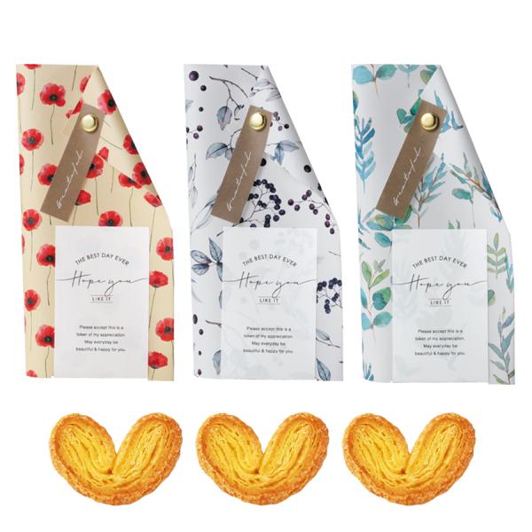ポピーやリーフ柄でお出かけしたい気分になる可愛いプチギフト。くるっと折り曲げられたユニークな形は、柔らかさや優しさを感じさせます。中には、人気のハート型のパイが3枚入っています。パッケージには素敵なメッセージが印字されているので、お礼や感謝...
