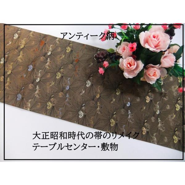 ■画像にある小物(ハンガーや花など)は商品に含まれません。◆大正昭和時代の100年前の帯のリメイク品になります。■サイズ---【cm】30　長さ約130■古い帯ですが状態が良く目立つダメージなく綺麗です。茶地につる草の文様で年代を感じるデザ...