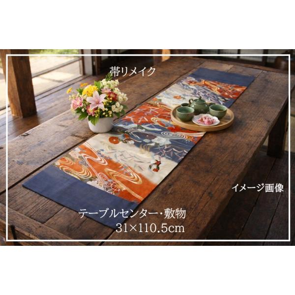 ■画像にある小物(ハンガーや花など)は商品に含まれません。◆帯のリメイク品になります。■サイズ---【cm】31　長さ約110.5■新品の帯をリメイクしました。青赤キナリのグラデーション地に流水に水車が見られ笹や菊などの小花と飛ぶ鳥の華やか...