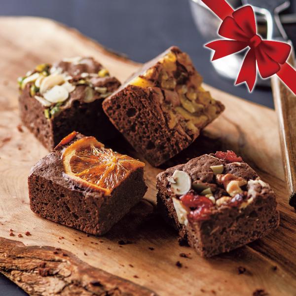 ●商品特徴濃厚なチョコレートの生地に、香ばしいナッツや甘酸っぱいフルーツをトッピング。ピスタチオとアーモンド、ごろっとしたパイナップルやネーブル、たっぷりのドライフルーツとナッツ。おいしさをぎゅっと詰め込んだキューブが、お口に小さなしあわせ...