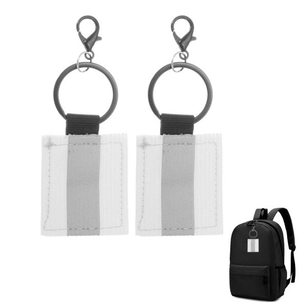 【本商品は海外出荷】お届けは通常20-30日を頂いております。【商品仕樣】タイプ：ナスカン付き / カラー：白 / サイズ：10x3.7cm(同色2個入り)【視認性を高める】反射効果で視認性を向上させ、夜間の安全を守ります。特に自転車や徒歩...