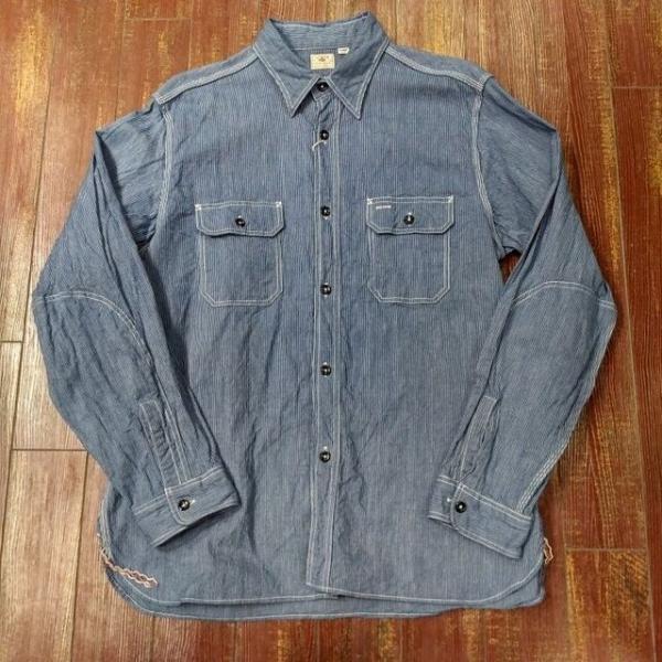 シュガーケーン ジーンコードワークシャツ SC25511シュガーケーンの定番ワークシャツ。エルボー部分は生地を二重にするなど、ワークディティールに富んだ一枚です。しっかりとした生地感と、着こなしを選ばない万能さが魅力です。