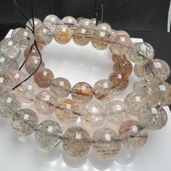 ランダム発送１連37-38cm分腕周り16cmブレスレット2本お届け鉱物名フォリエテェットマイカインクォーツ水晶にマイカ(雲母)がブラウンやブラック、ブロンズの針がルチルのように光りの反射で美しいメタリックな輝きを放ち、深い癒しのエネルギー...