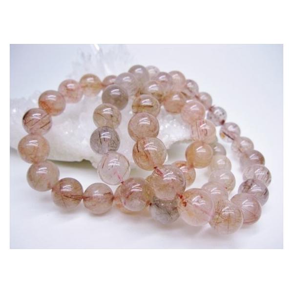 【ブレスレット】レッドルチルクォーツ☆商品情報☆石サイズ：Φ11-11.9mm粒数：18-19粒手首周り：約17-18cm原産地：ブラジル※形状やサイズのばらつき、表面や穴周りにキズや凹み等があります。粒数はあくまで目安です。多少の誤差があ...