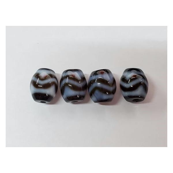 【チベット高級至純天珠】虎牙水紋天珠☆商品情報☆長さ：12±1mm直径：Φ10±1mm穴サイズ：Φ1.8±0.2mm中国・チベット天珠※現在の在庫につきまして、形状が歪なものとなります。ご理解いただいた上ご注文下さいますようお願いいたします...