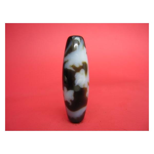 【チベット高級至純天珠】龍神天珠☆商品情報☆長さ：約38mm直径：約Φ12mm穴サイズ：約Φ2mm中国・チベット天珠※照明等の関係で実際の色とは多少イメージが異なる場合もありますのでご了承ください。※こちらは一点物ですので、画像の商品のお届...