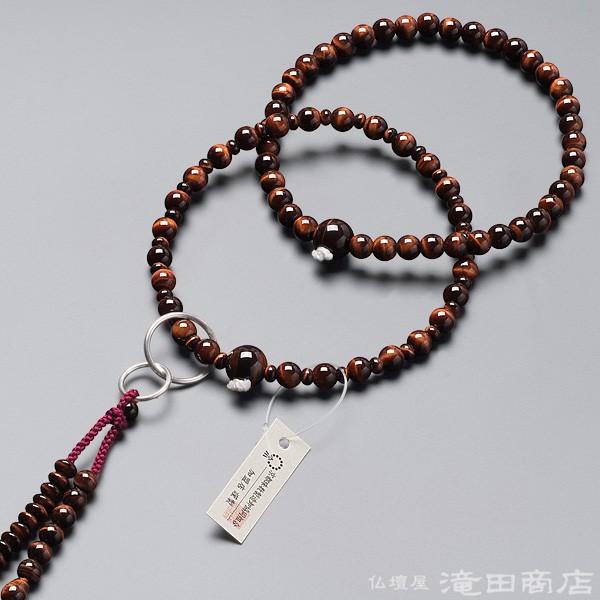 珠の素材：赤虎目石房の素材：正絹華梵天房（エンジ色）サイズ：六万浄土8寸サイズ宗派：浄土宗・時宗の本式数珠備考：数珠袋付き　　　数珠は桐箱入り浄土宗・時宗用の正式な女性用の念珠です。赤虎目石の7mm玉を使用しました。正絹の華梵天房がついてい...