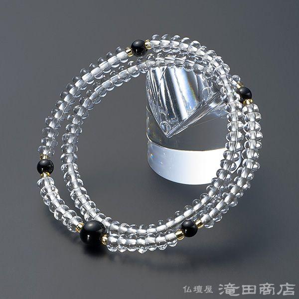 珠の素材：本水晶 みかん玉 主珠108個　　　　　親珠・四天珠に黒オニキスを使用中糸の素材：オペロンゴム（シリコンゴム）サイズ：内周 約16.5cm〜約17.5cm宗派：すべての宗派でお使いいただけます備考：携帯用ポーチ袋付き本式数珠と同じ...
